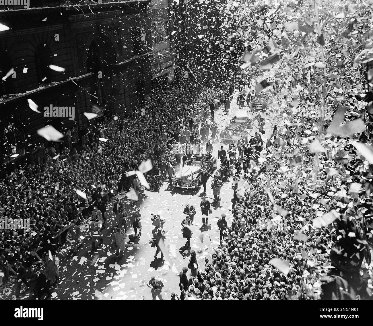 A blizzard of ticker tape and confetti virtually blots out the scene on ...
