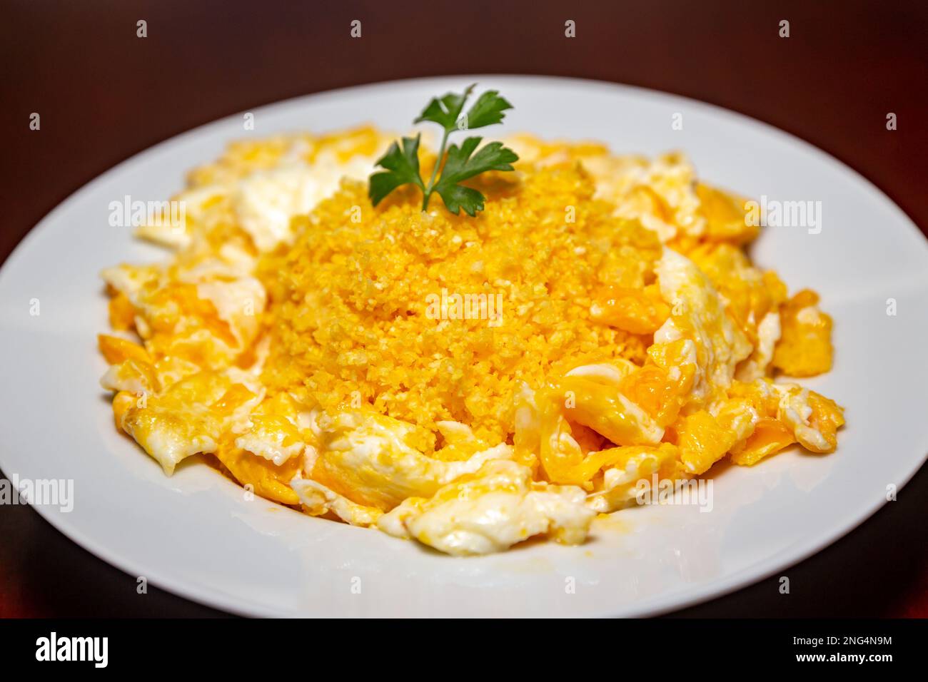 Traditional popular Brazilian dish, couscous with egg garnished with ...