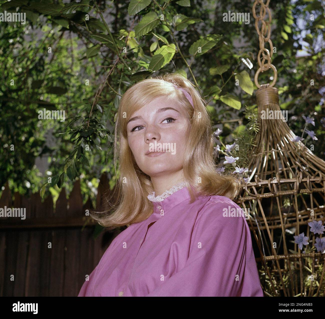 Actress Yvette Mimieux stands in the garden of her home in this photo ...