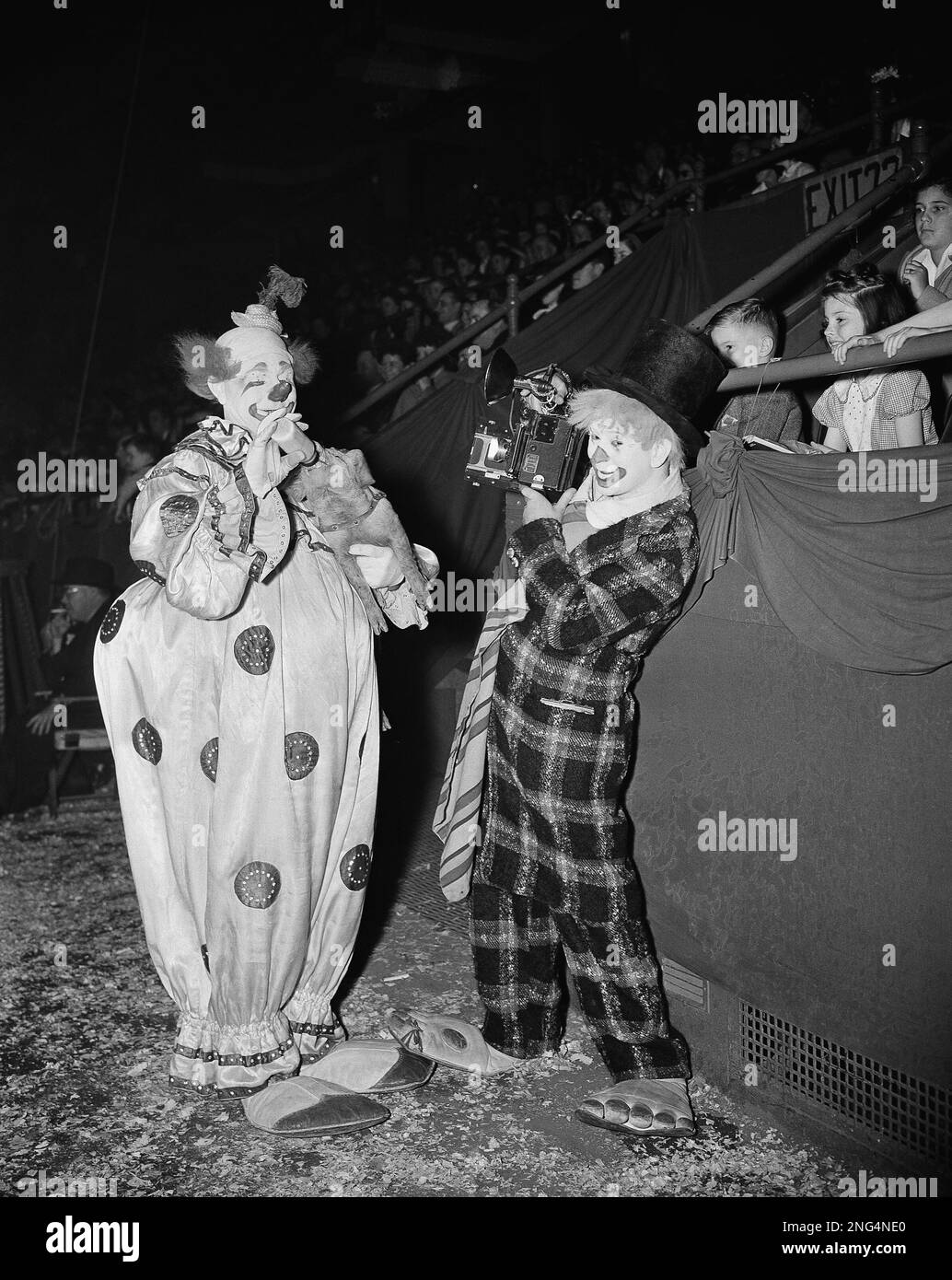 Kenneth Lucas, clown photographer, takes a picture of Felix Adler, "The ...