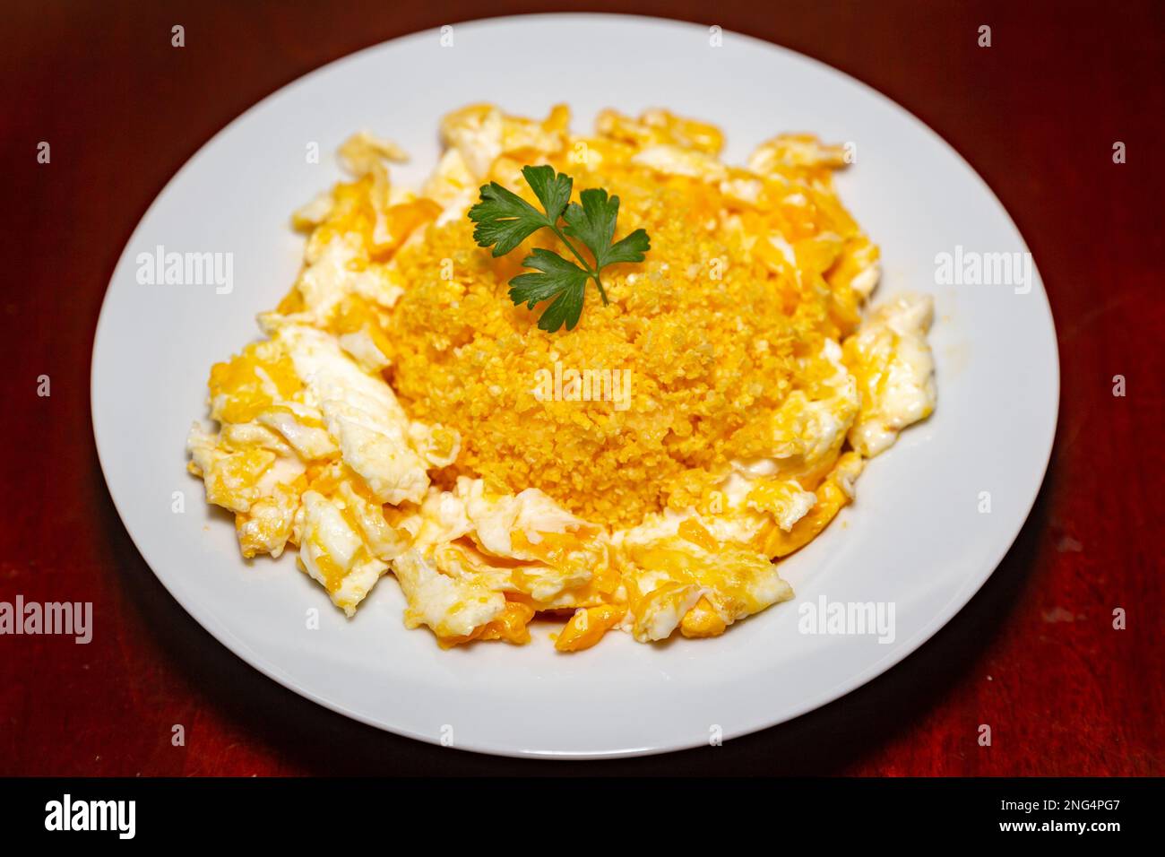 Traditional popular Brazilian dish, couscous with egg garnished with ...