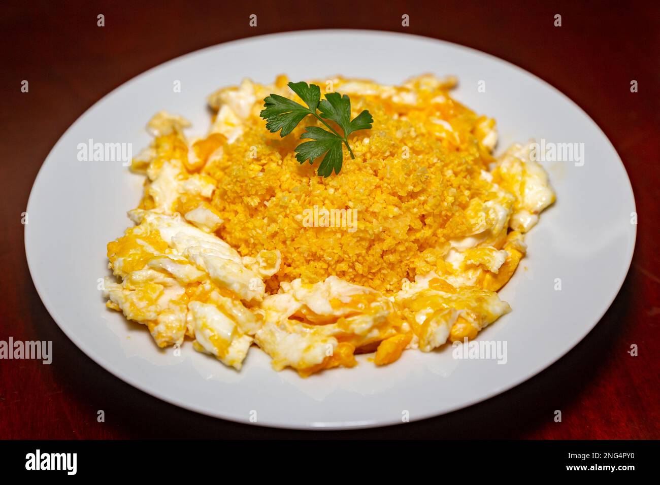 Traditional popular Brazilian dish, couscous with egg garnished with ...