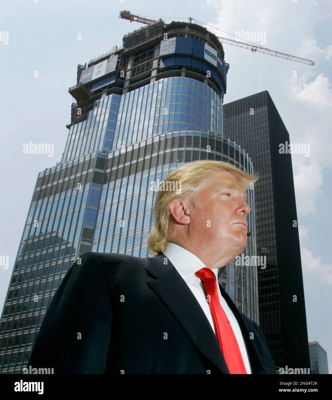 Real estate mogul Donald Trump is profiled against his 92-story Trump ...
