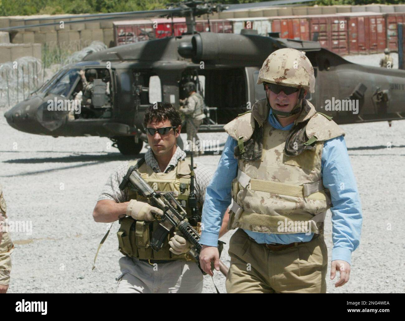 Canadian Prime Minister Stephen Harper walks from an American Blackhawk ...