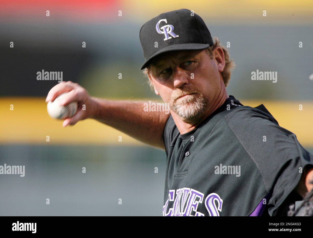Colorado Rockies coach Jamie Quirk throws batting practice before the ...