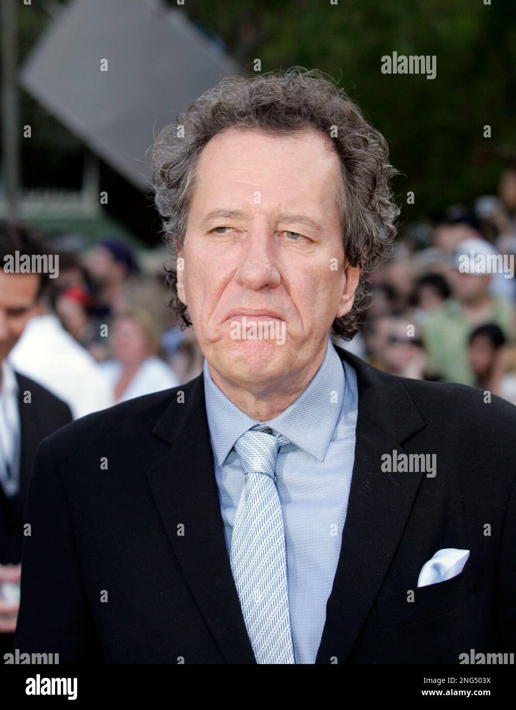 Actor Geoffrey Rush poses for photographers at the film premiere of ...