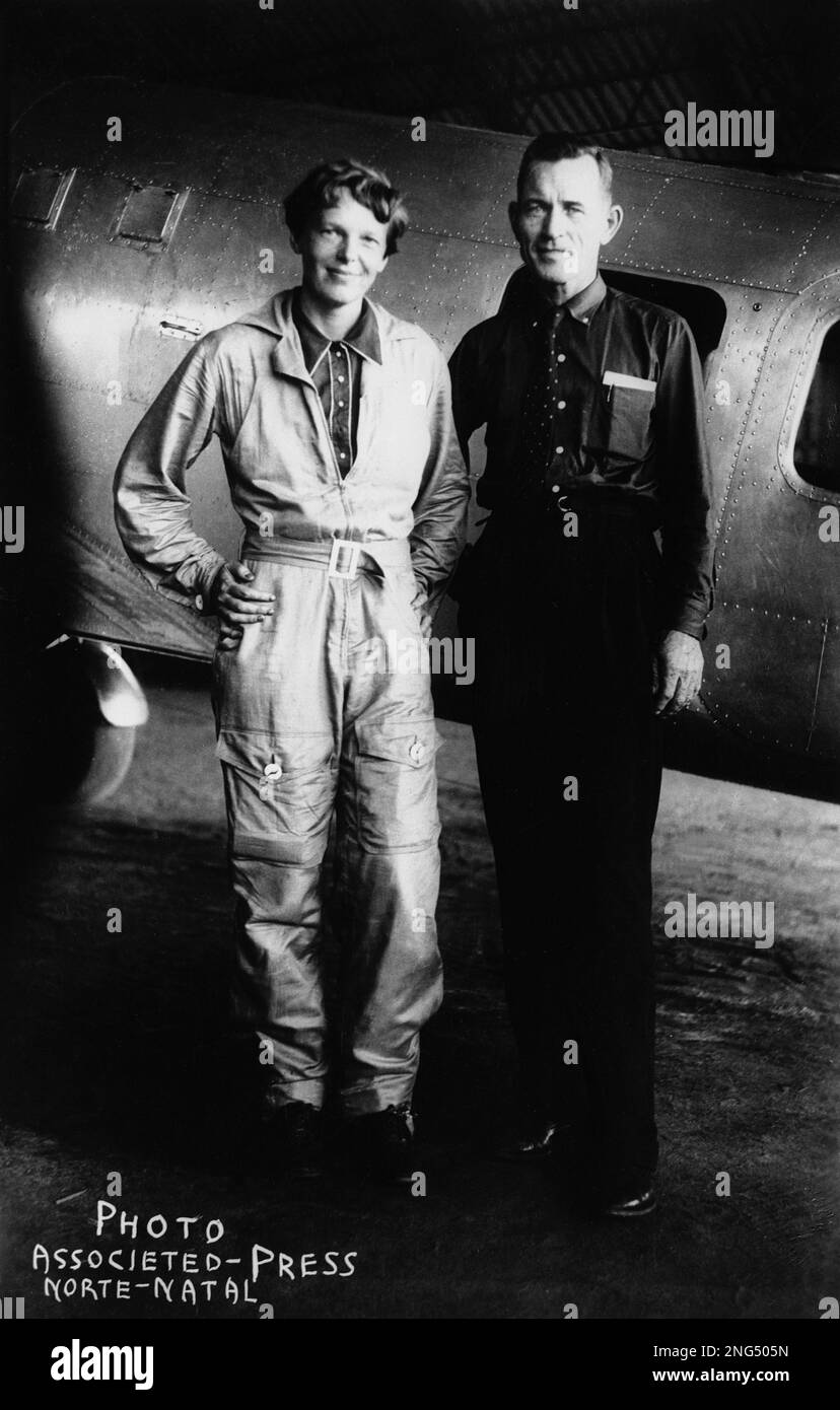 Famed aviatrix Amelia Earhart and her navigator, Fred Noonan, pose in ...