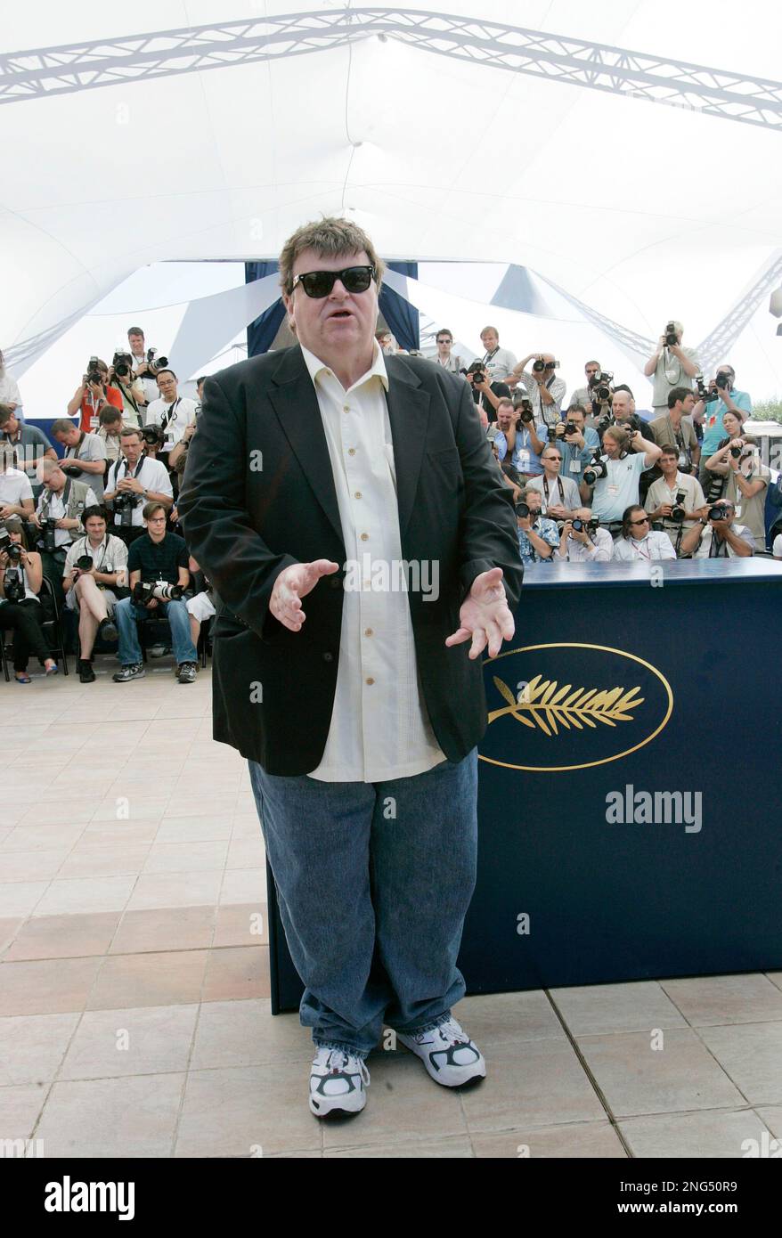 American director Michael Moore pose during a photo call for the film ...