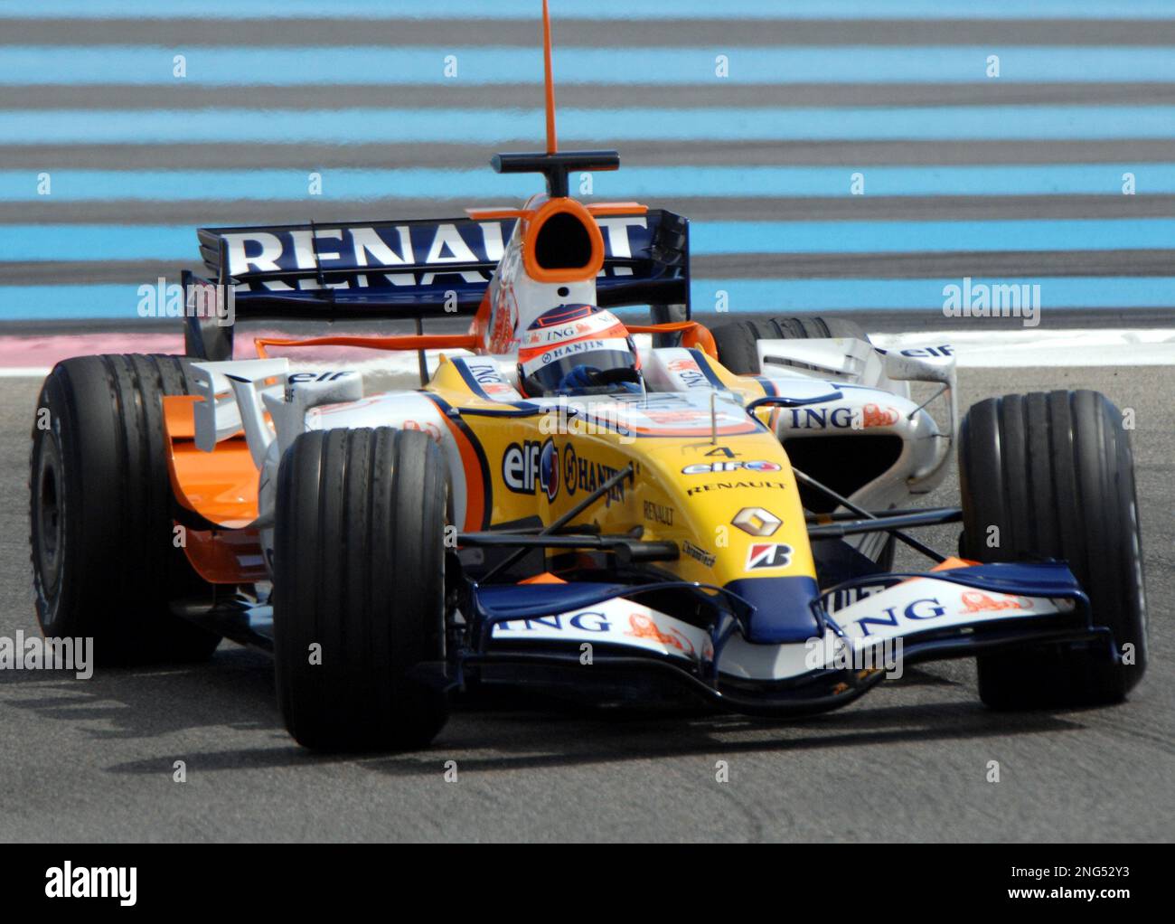 Heikki Kovalainen of Finland steers his Renault, during a testing ...