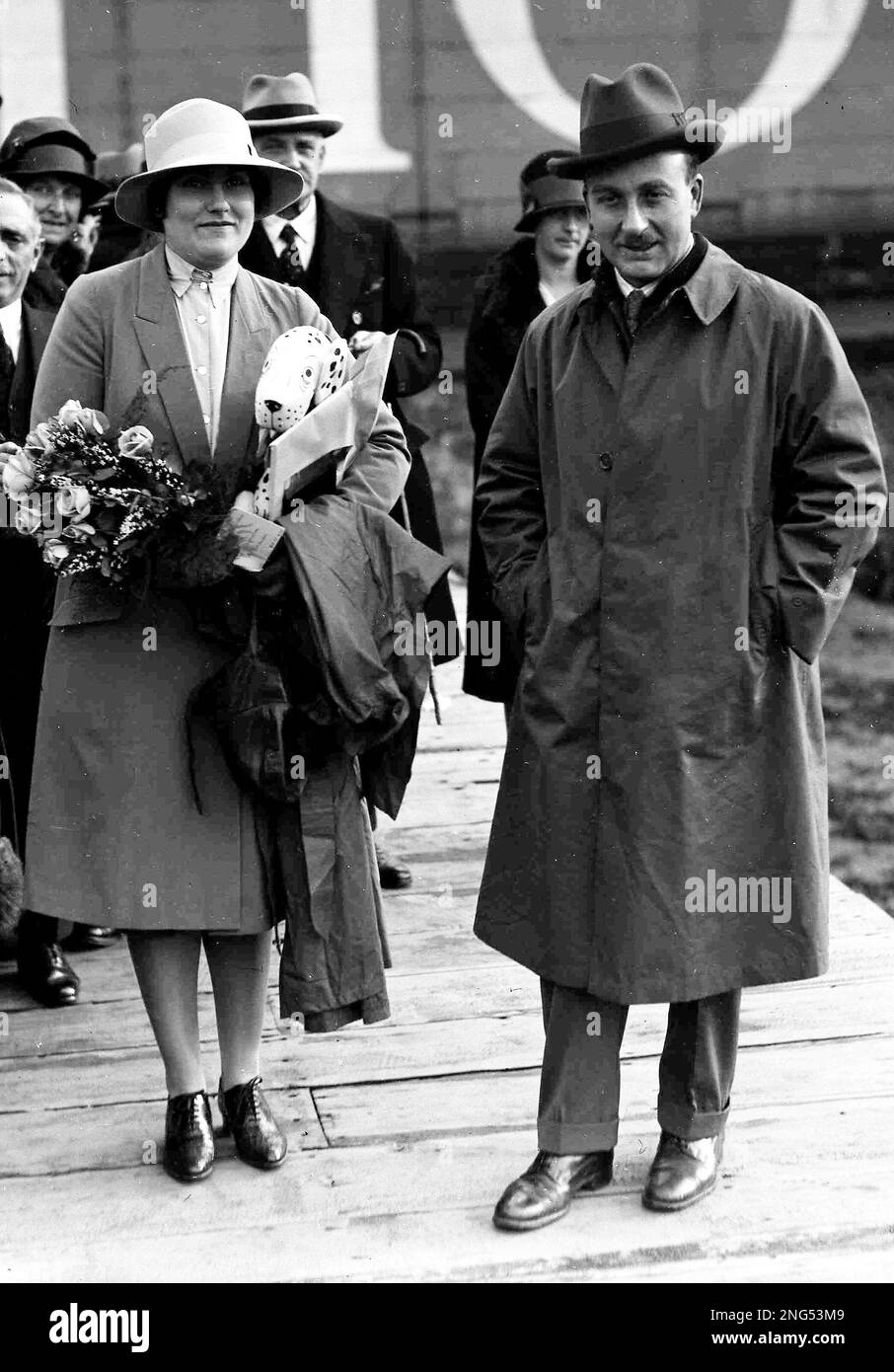 British aviator Sir Alan Cobham and his wife Lady Gladys, wait to board ...
