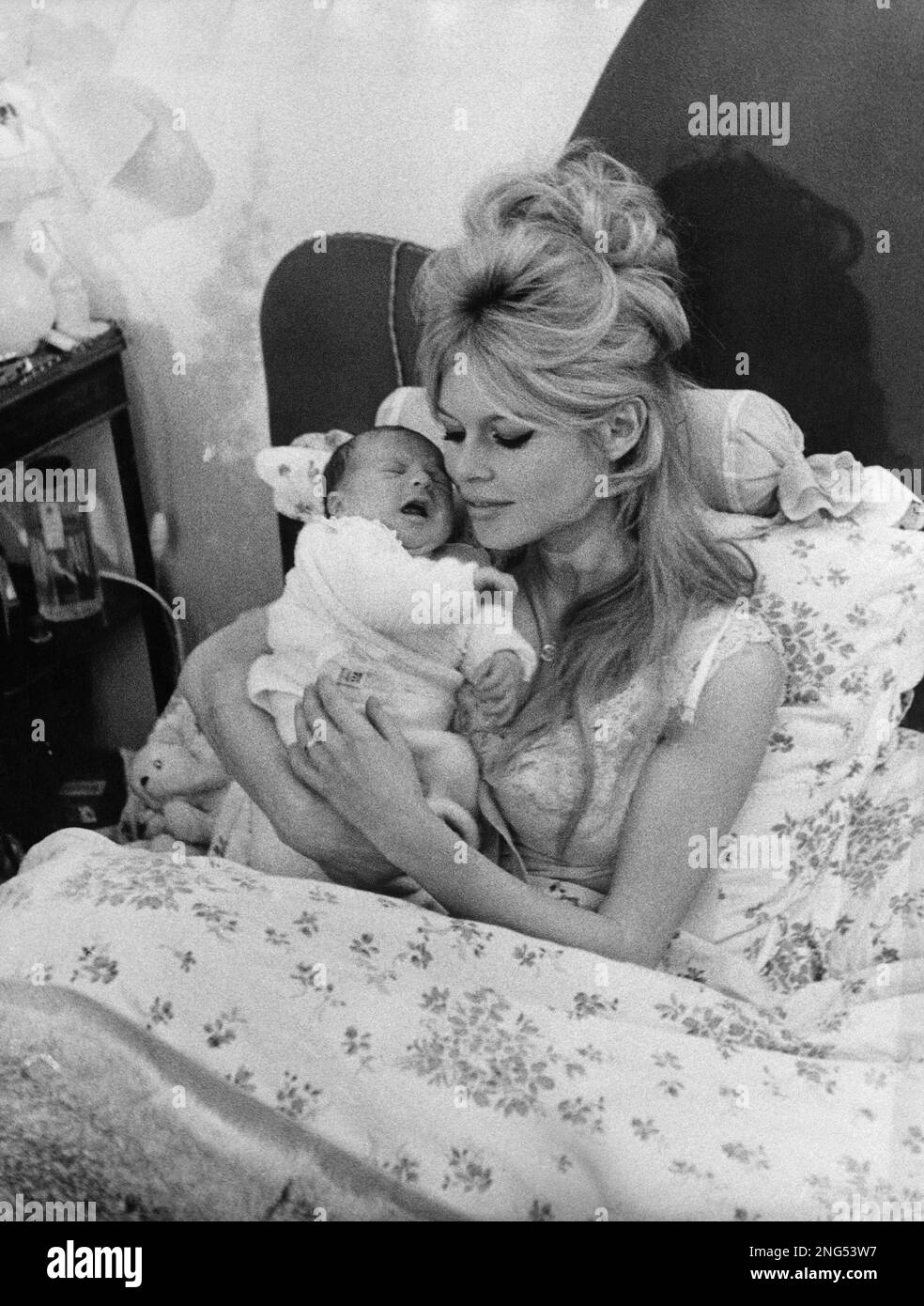 Brigitte Bardot holds her new son Nicolas in her Paris apartment ...