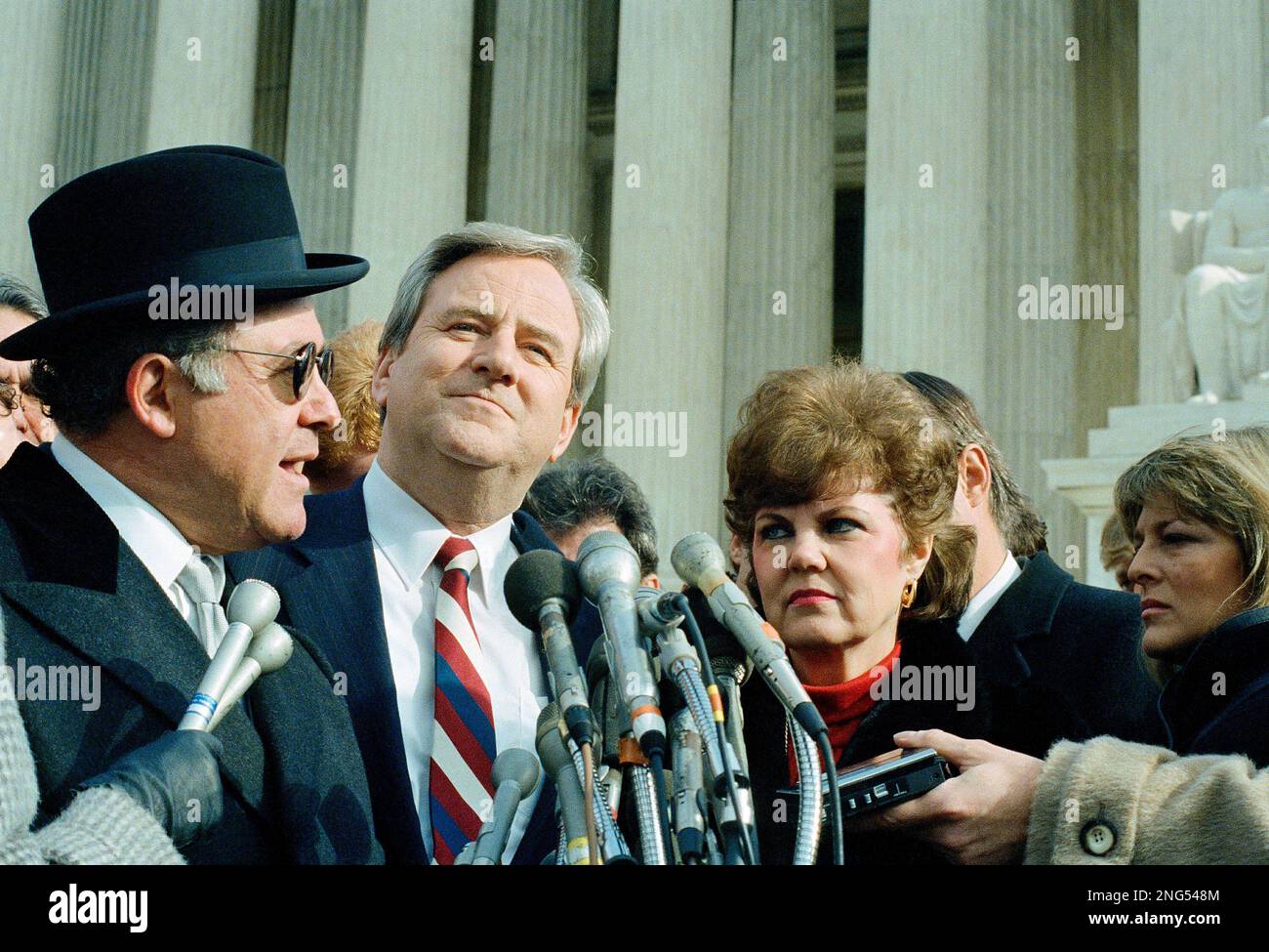 The Rev. Jerry Falwell, center, listens as his legal counsel, Norman ...