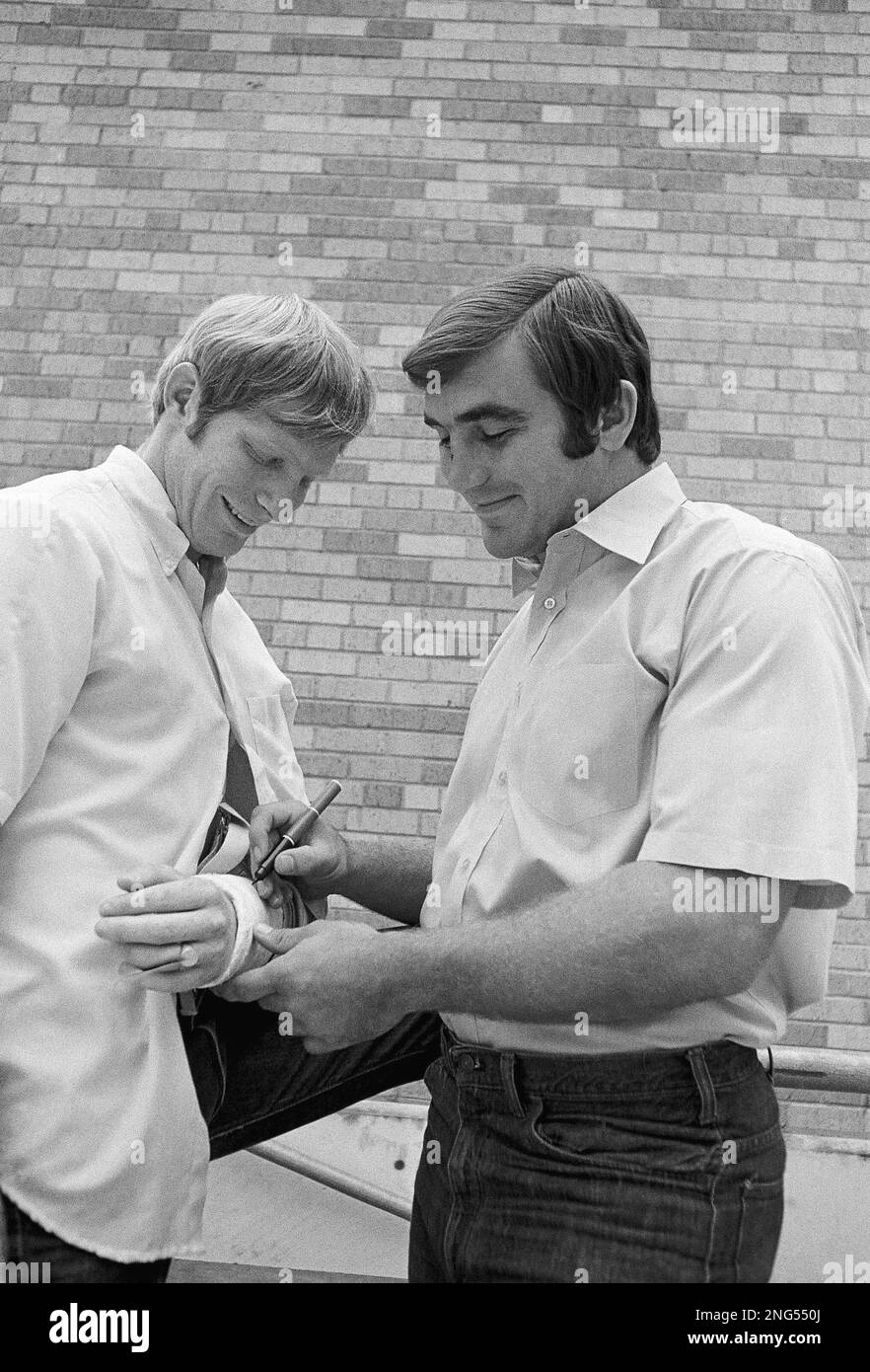 University of Texas split end Charles "Cotton" Speyrer, left, who broke his left arm in action ...