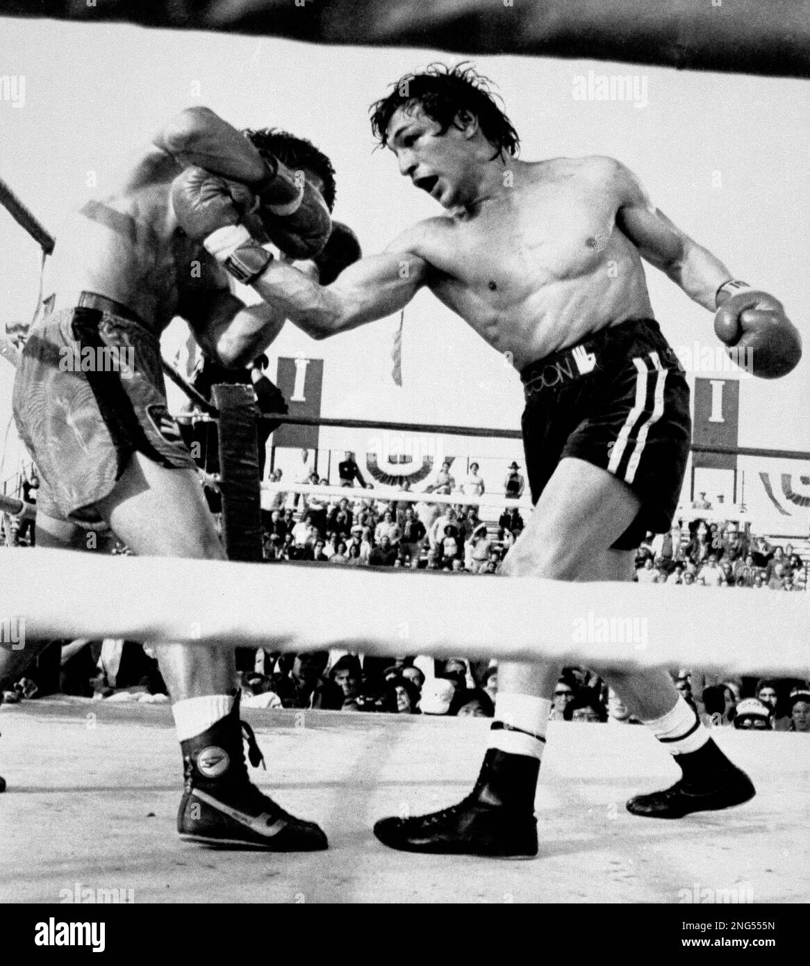 American boxer Ray 'Boom Boom' Mancini, right, throws a vicious right ...