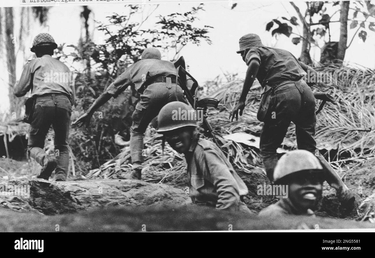 A company of Biafran soldiers leave their positions to advance on a ...