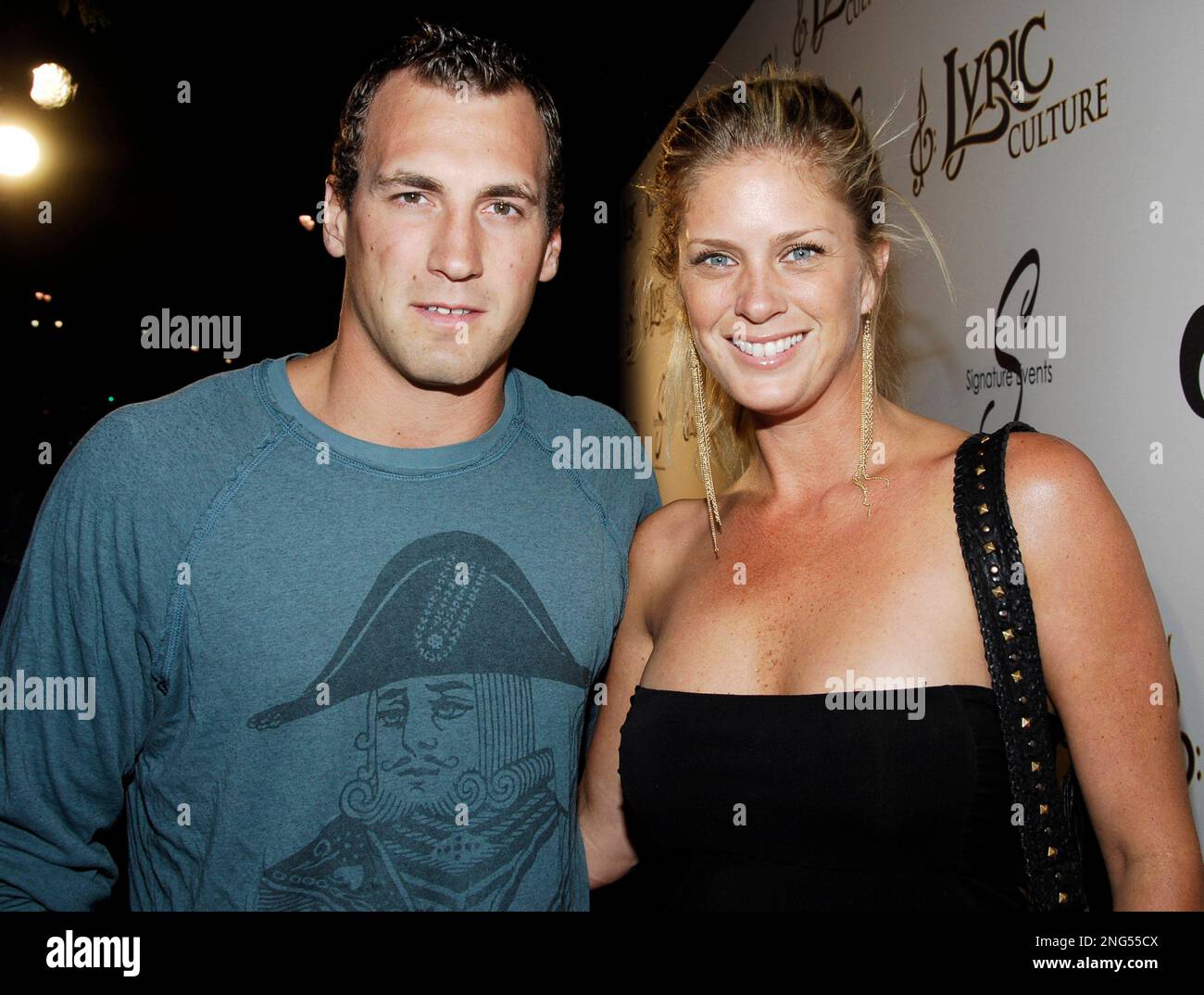 Model Rachel Hunter, right, and Jerry Stoll, left, pose on the press ...