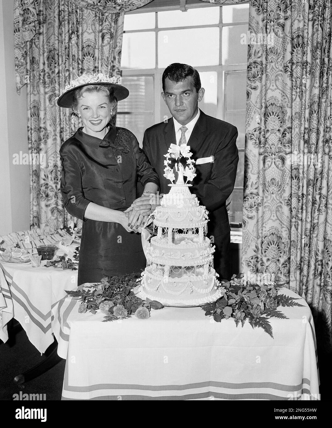 Singer Helen O'Connell, and novelist Tom T. Chamales are shown cutting ...