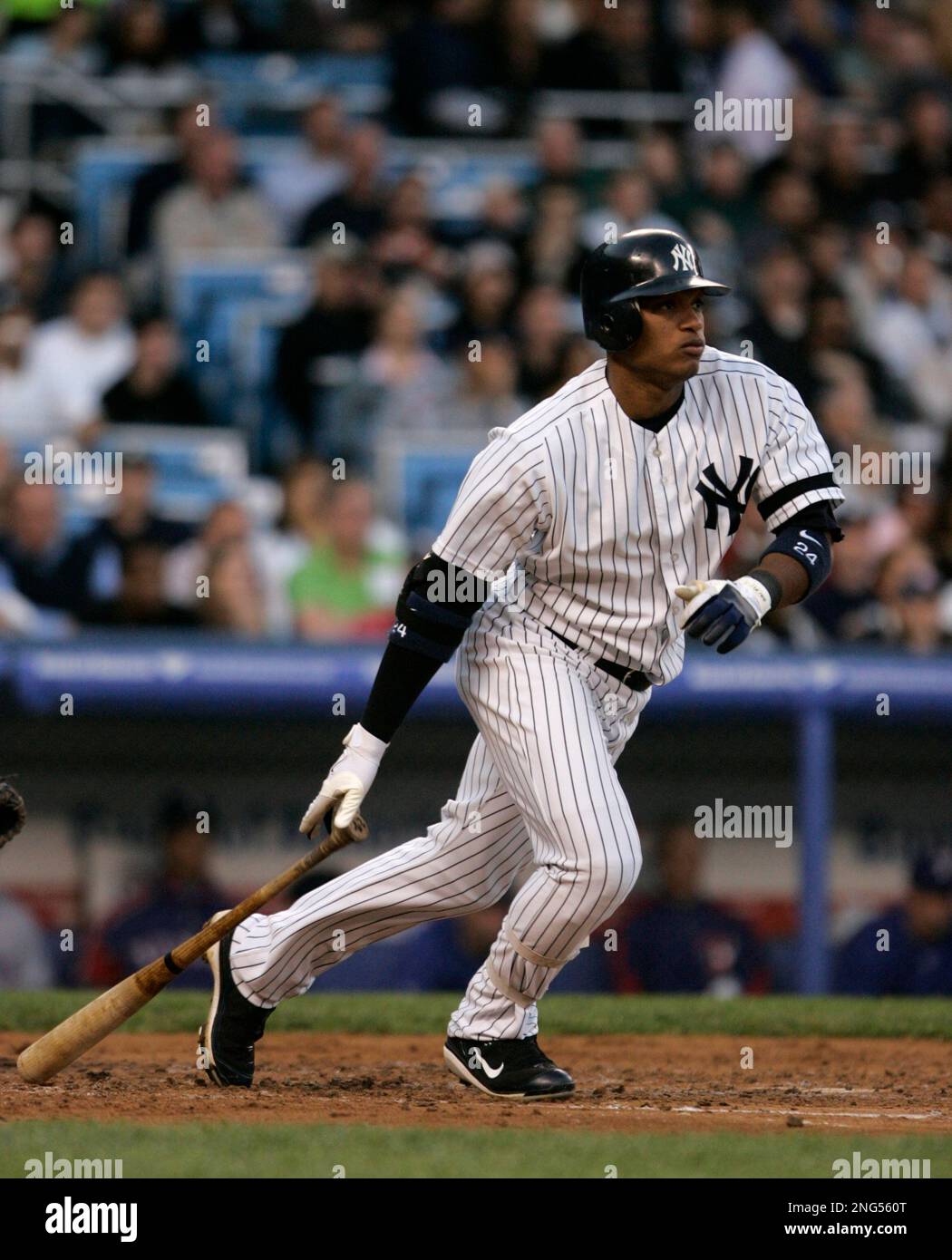 New York Yankees' Robinson Cano follows through on a ground ball ...
