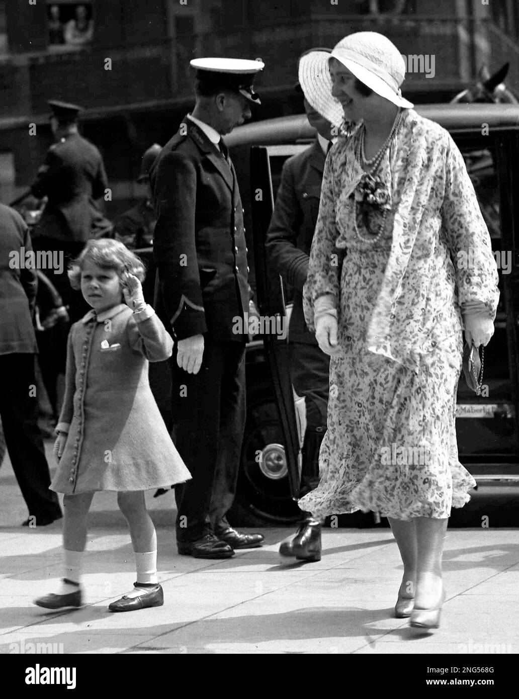 Britain's Princess Elizabeth salutes the cheering crowd as she arrives ...