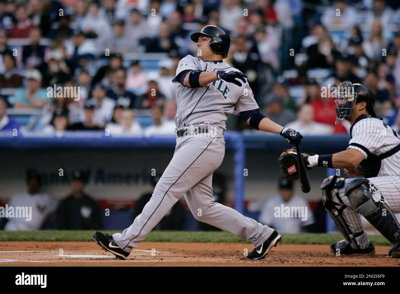 Seattle Mariners Jose Vidro connects as New York Yankees catcher Jorge ...