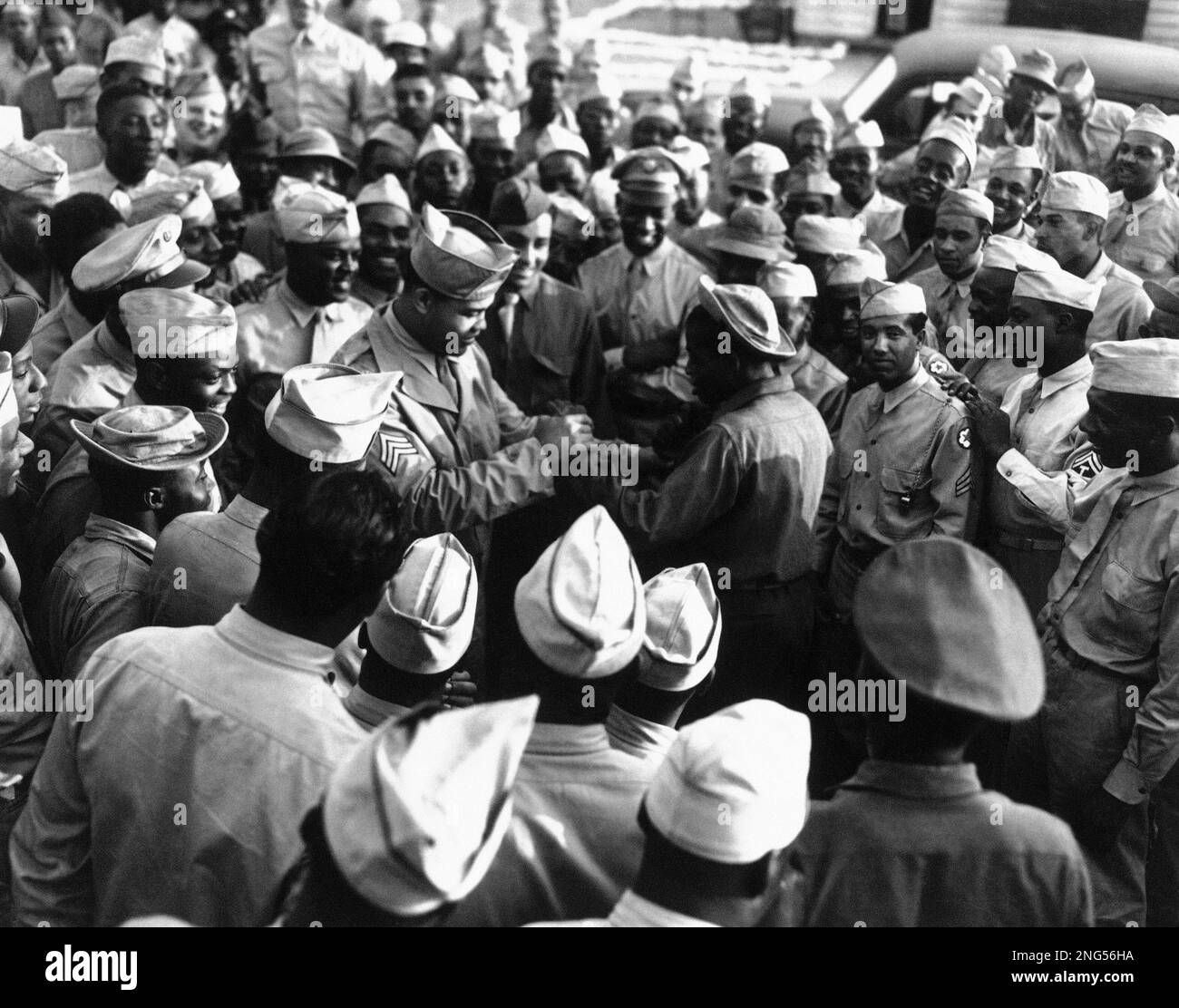 Sergeant Joe Louis signs his autograph for the black outfits stationed ...