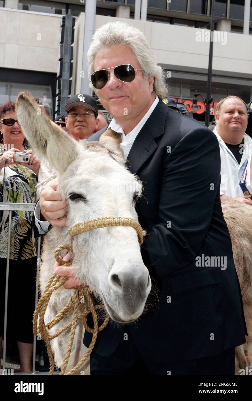 Legendary Hollywood producer Jon Peters poses with a donkey ...