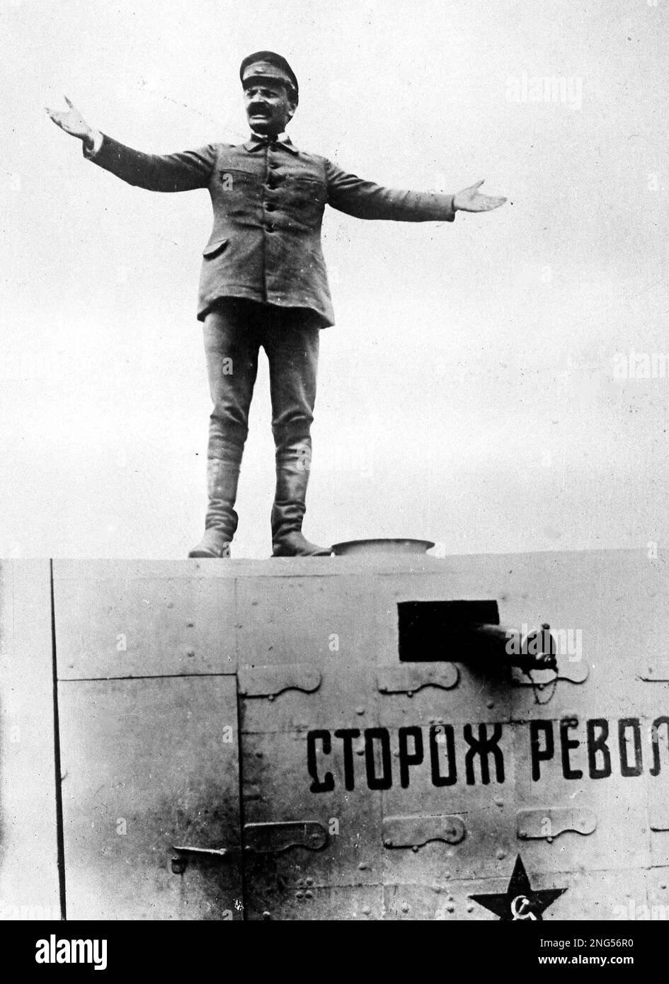 Leon Trotsky, founder and leader of the Red Army, stands on a tank and ...