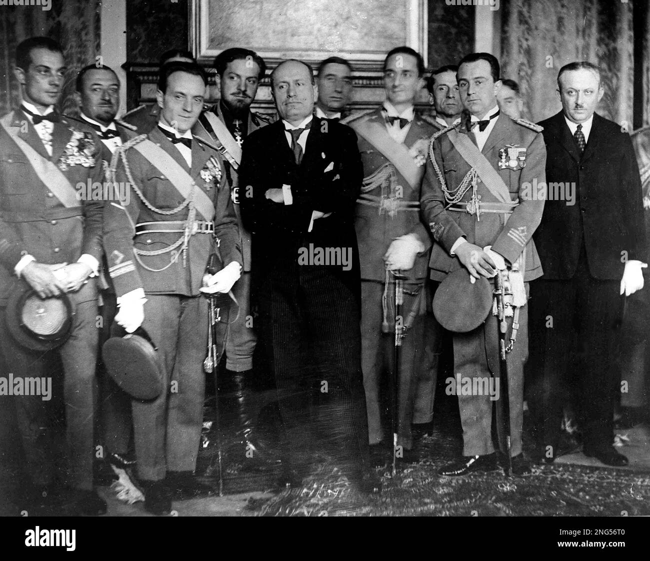 Italian dictator and Prime Minister Benito Mussolini, centre with arms ...