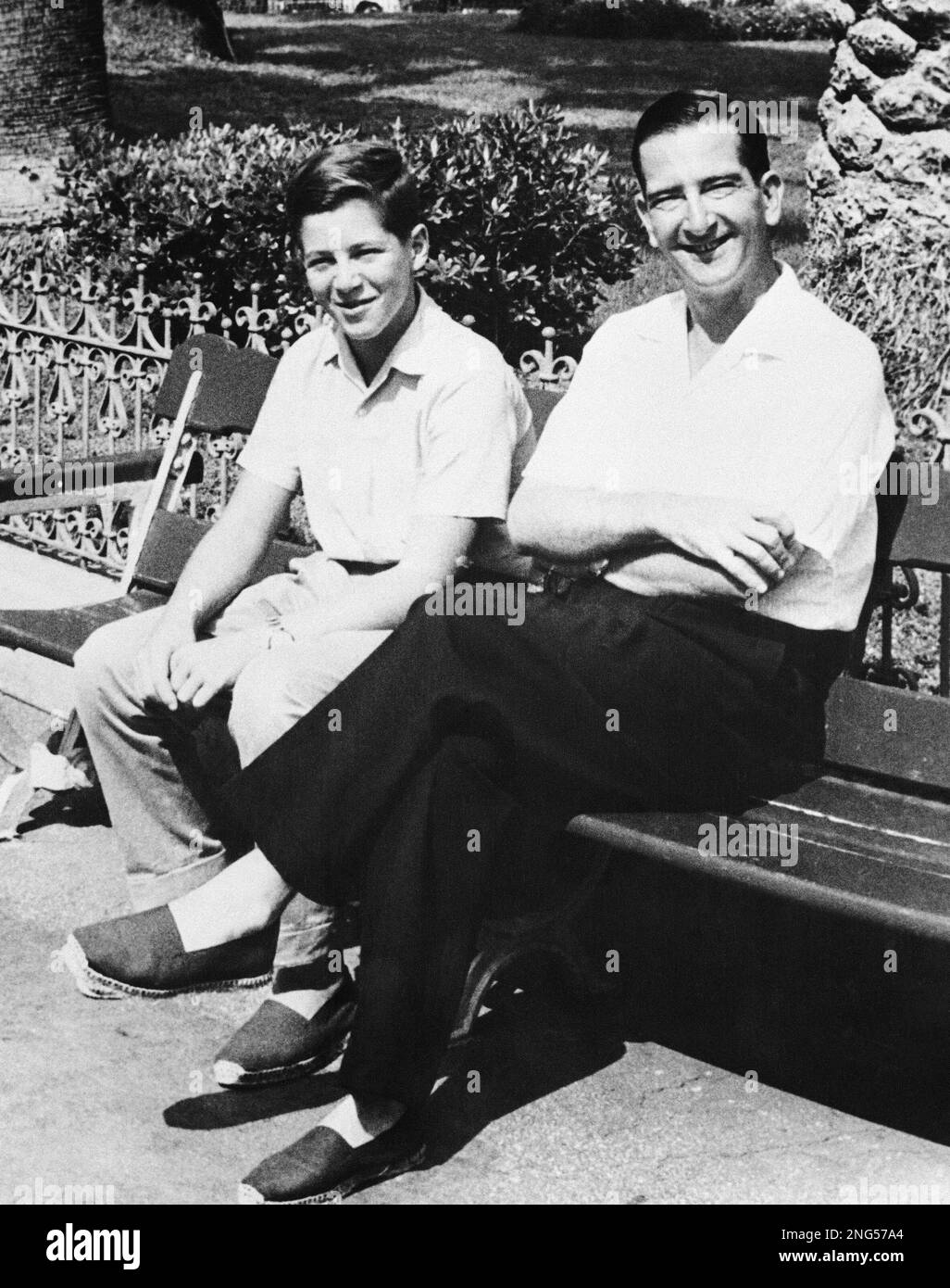 Former King Peter of Yougoslavia and his son Prnce Alexander sit and ...