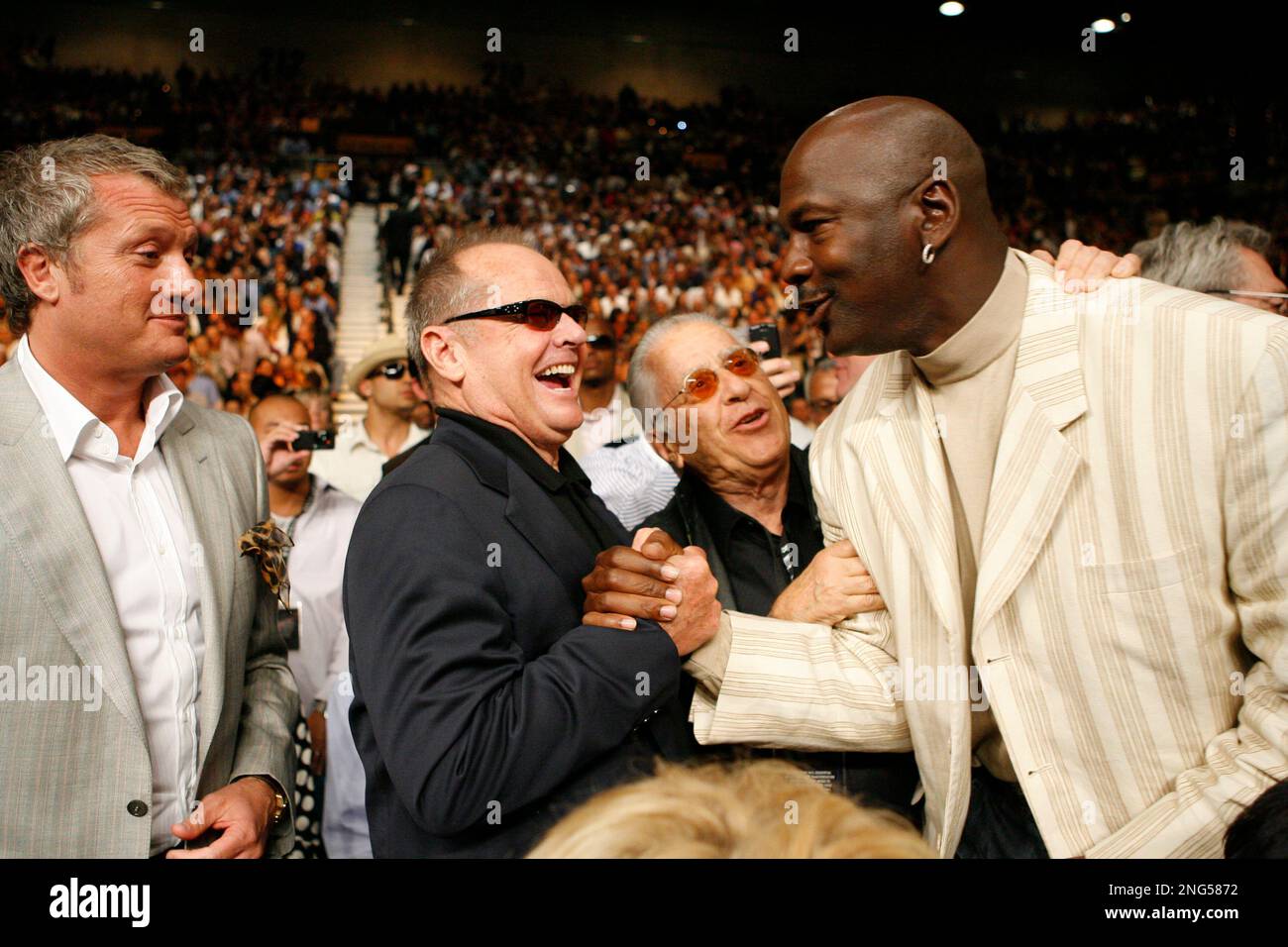 Basketball great Michael Jordan, right, talks with actor Jack Nicholson ...