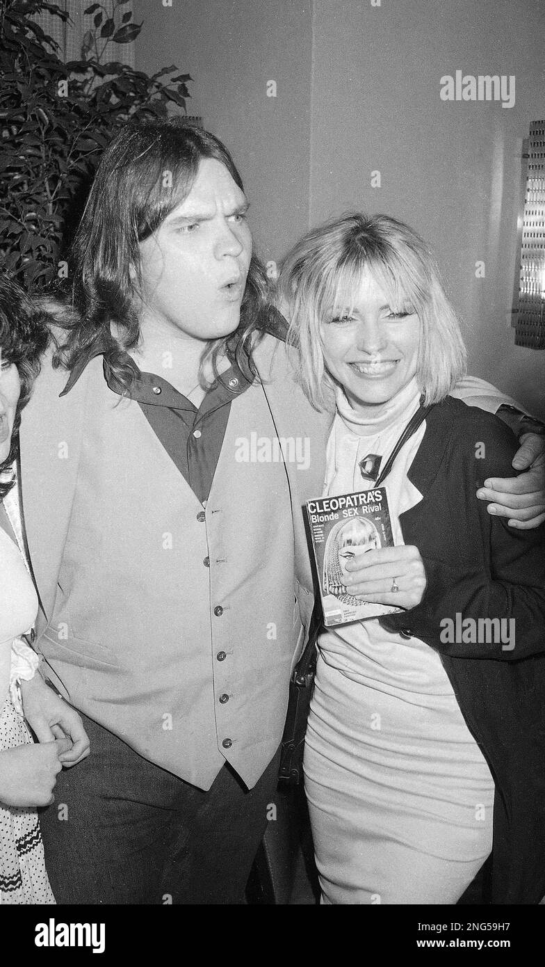 Rock star Meat Loaf is shown with his arm around Blondie lead singer ...