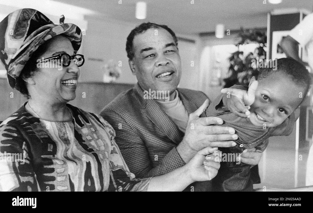 Former heavyweight champion Joe Louis, holds his son, Joe Louis Jr, 21 ...