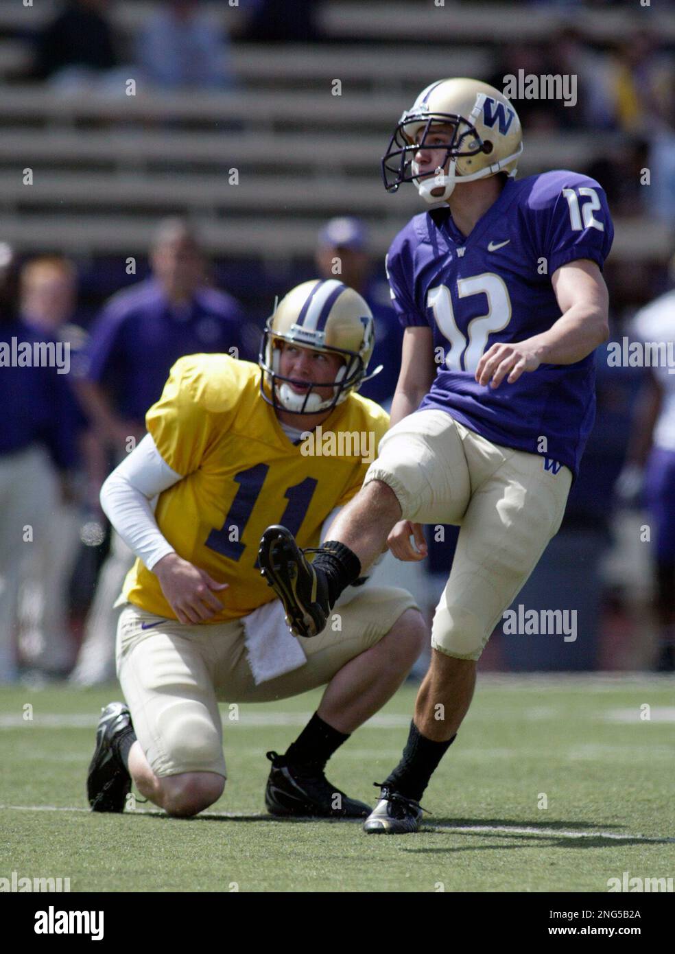 Washington kicker Jared Ballman, right, watches his point after clear ...