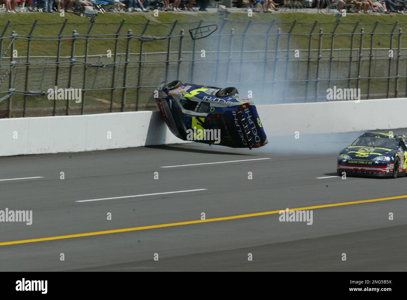 Driver Kyle Busch (5) wrecks on the back stretch during the 27th lap of ...