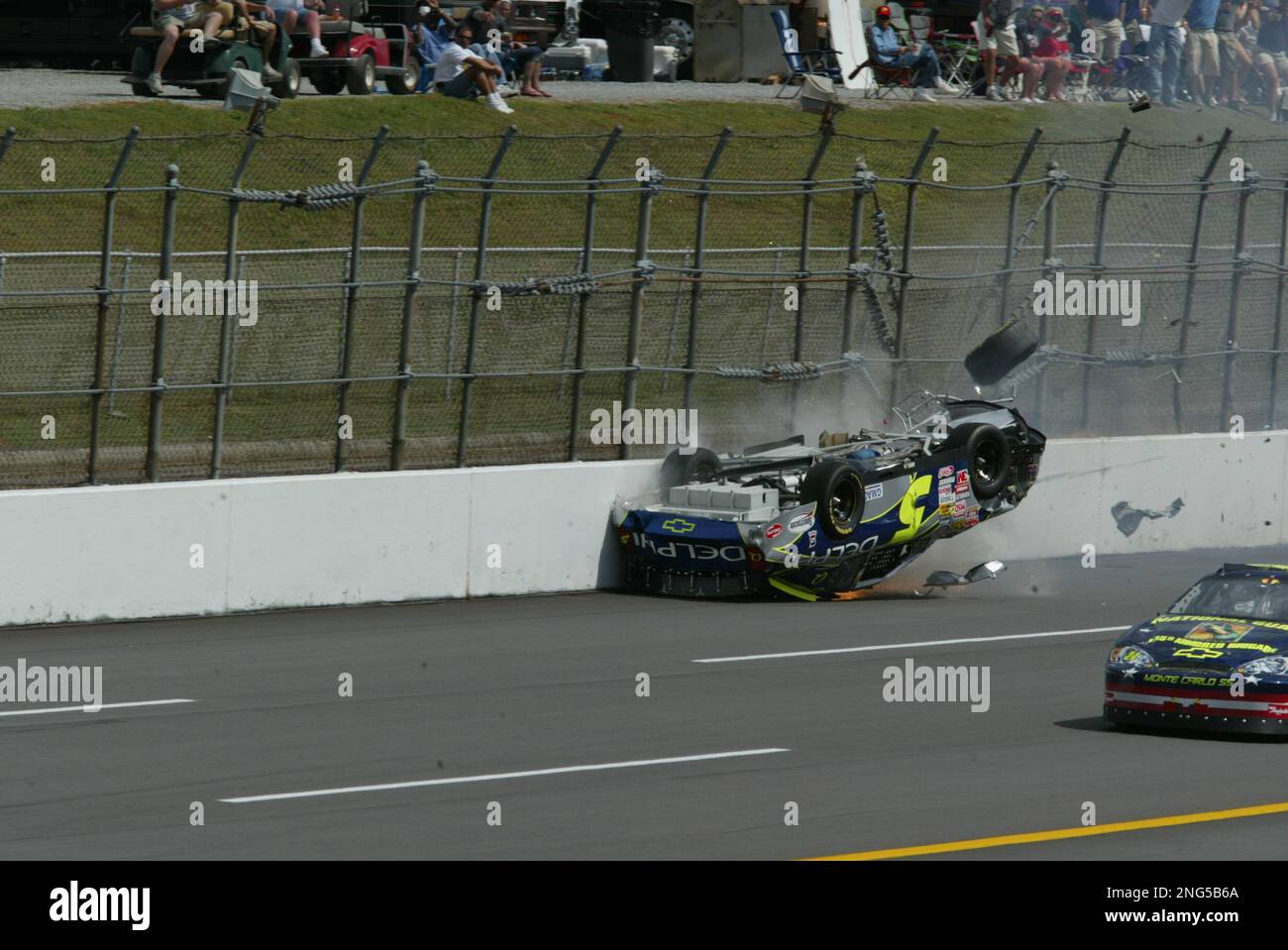 Driver Kyle Busch (5) wrecks on the back stretch during the 27th lap of ...