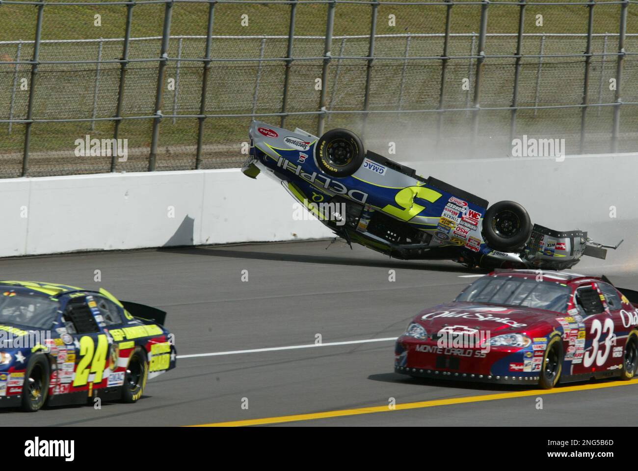 Driver Kyle Busch (5) wrecks on the back stretch during the 27th lap of ...