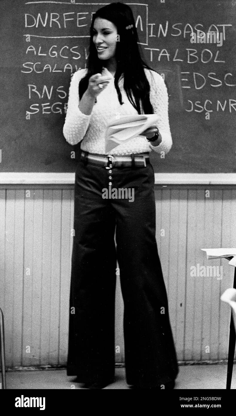 Faren Sanders, a school teacher, is seen in front of her classroom in ...