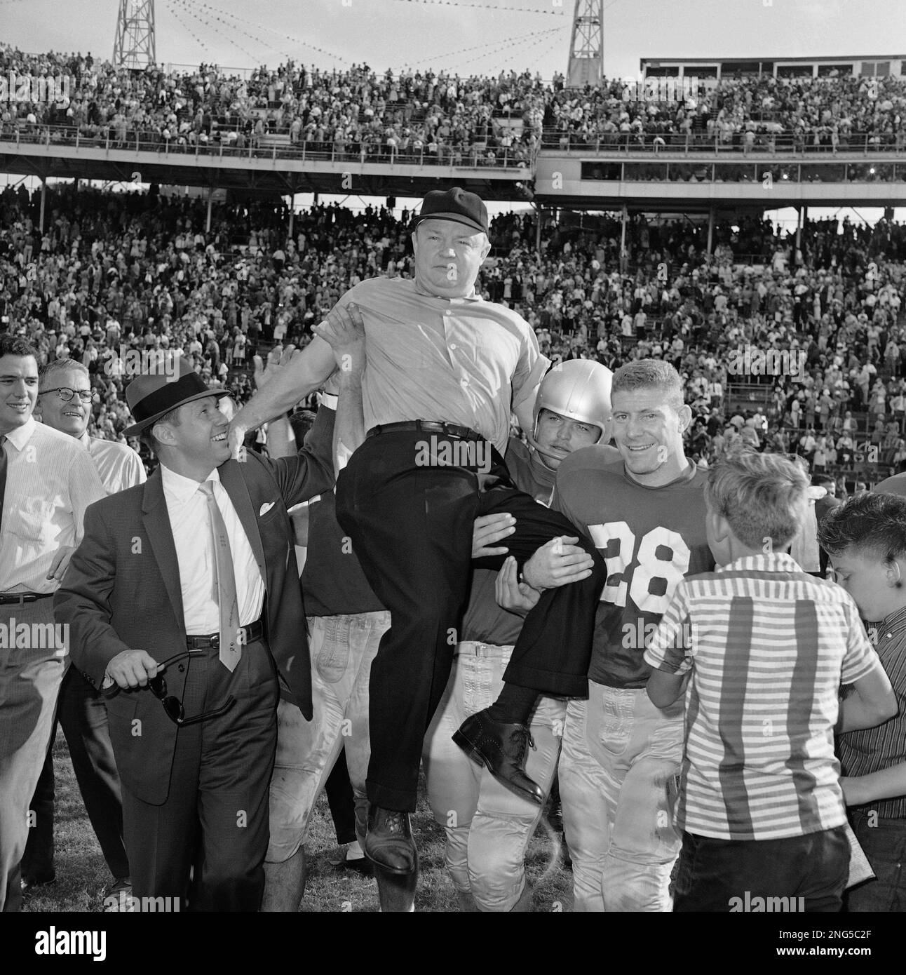University of Georgia coach Wally Butts is carried off the field after ...