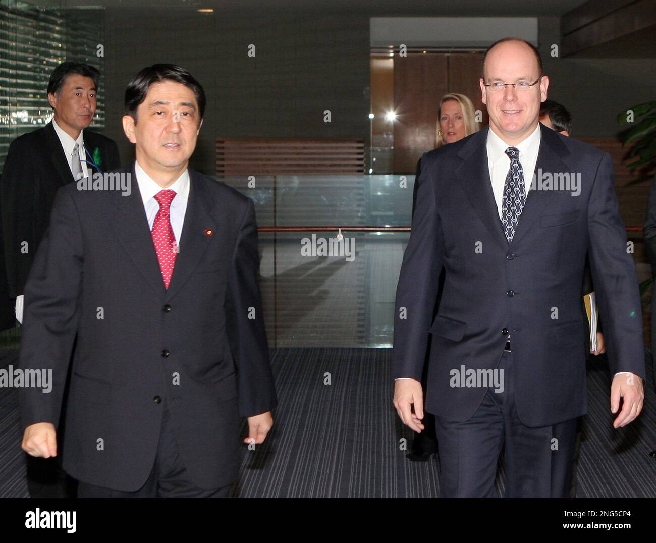 Prince Albert II of Monaco, right, walks with Japanese Prime Minister ...