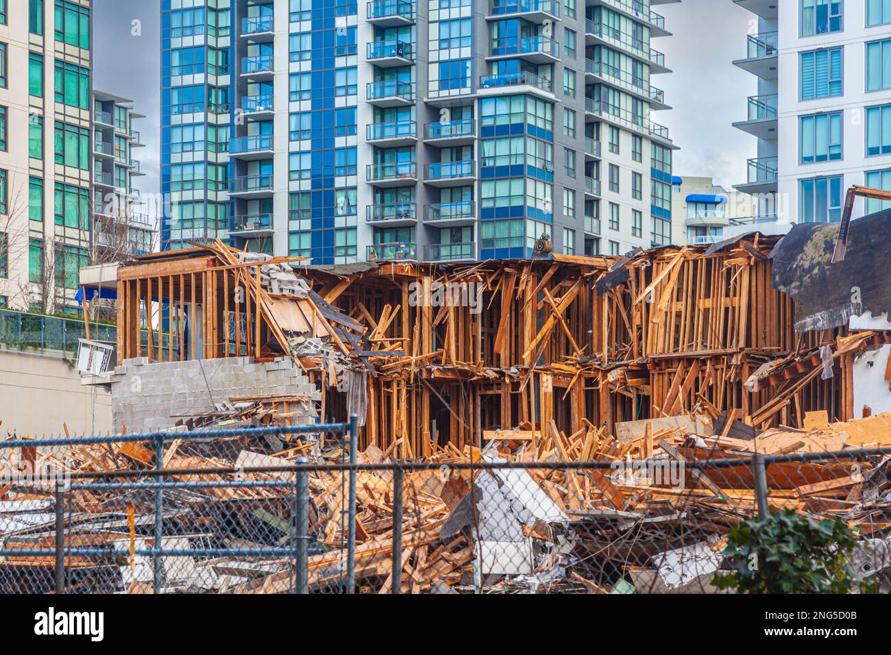 Demolishing wood framed buildings to make space for a new tower in ...