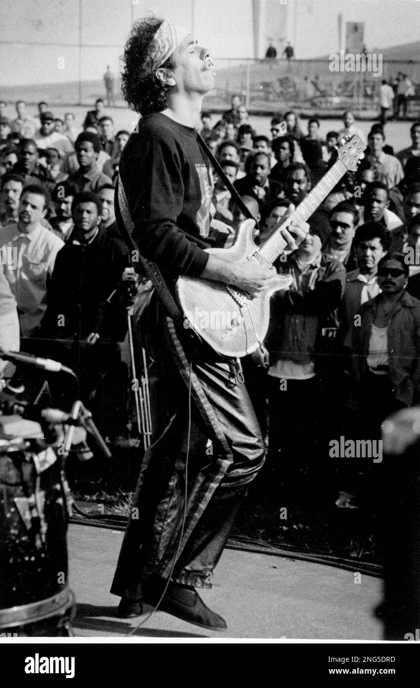 Rock guitarist Carlos Santana performs for a crowd of an estimated ...