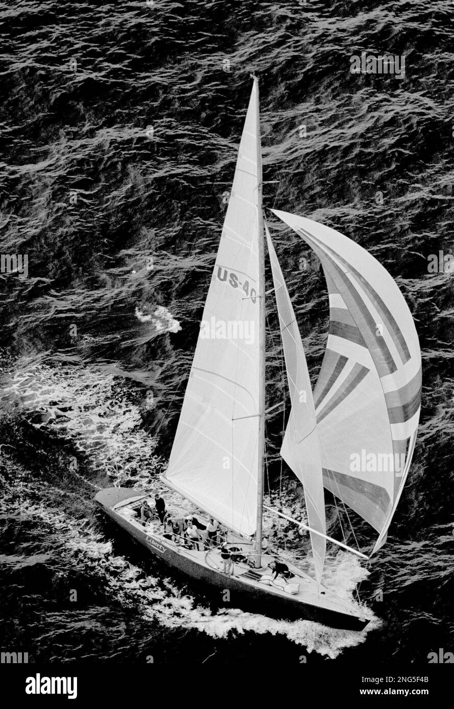 The U.S. 12-meter yacht Liberty sails with spinnaker out after rounding ...