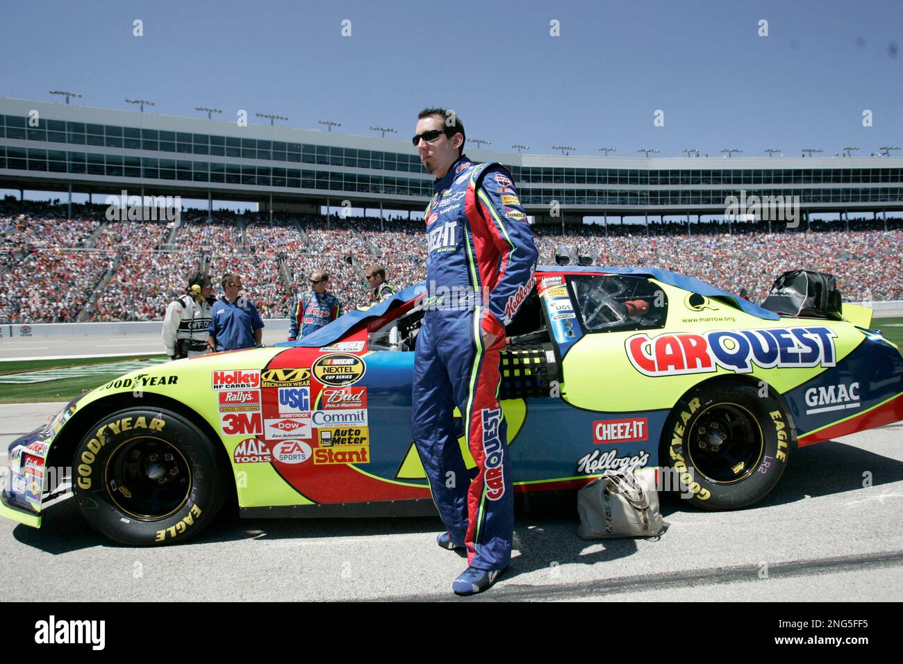 NASCAR driverKyle Busch stands by his car before the start of the ...
