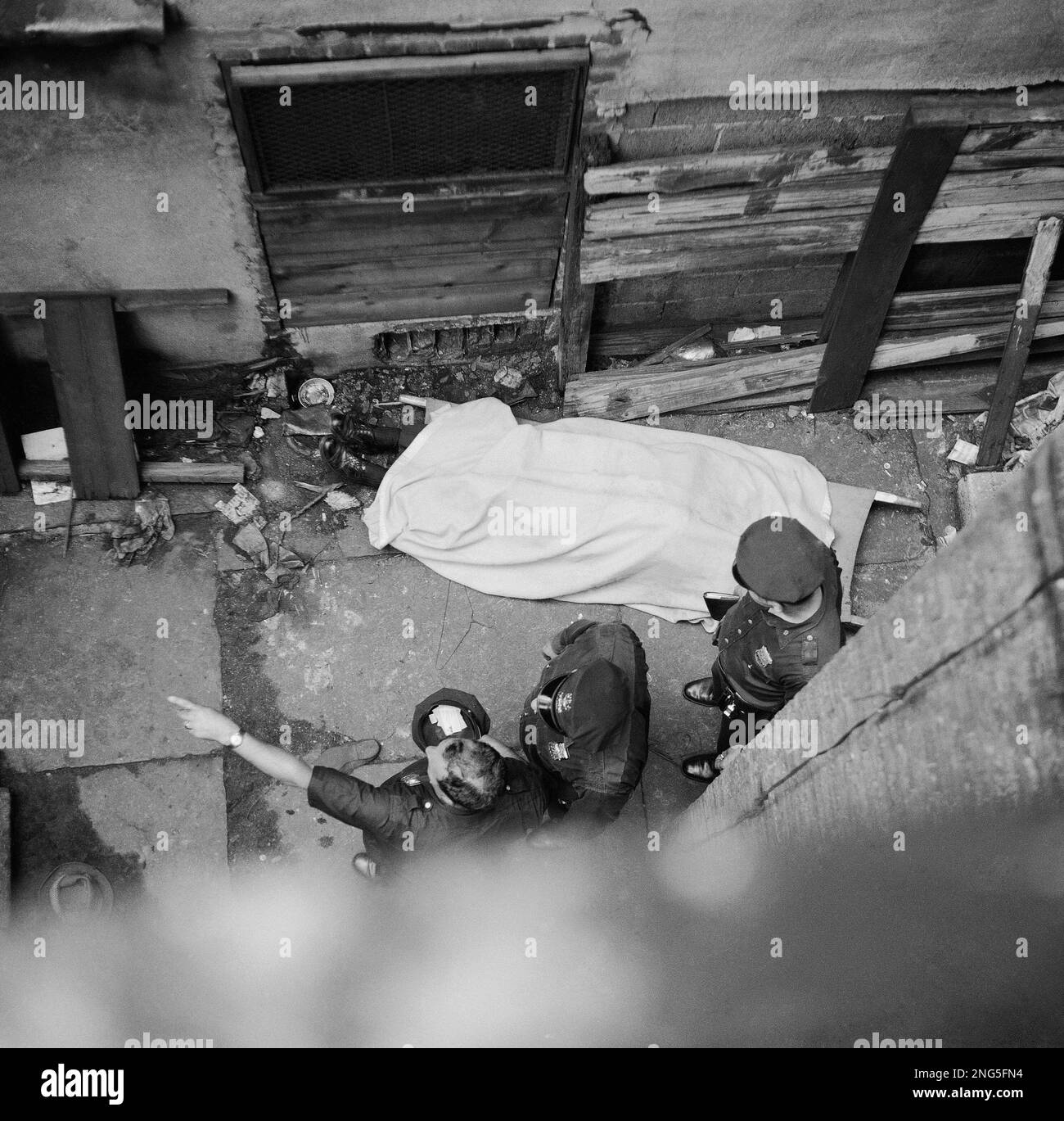 The body of policeman Henry Walburger, 24, lies on stretcher in ...