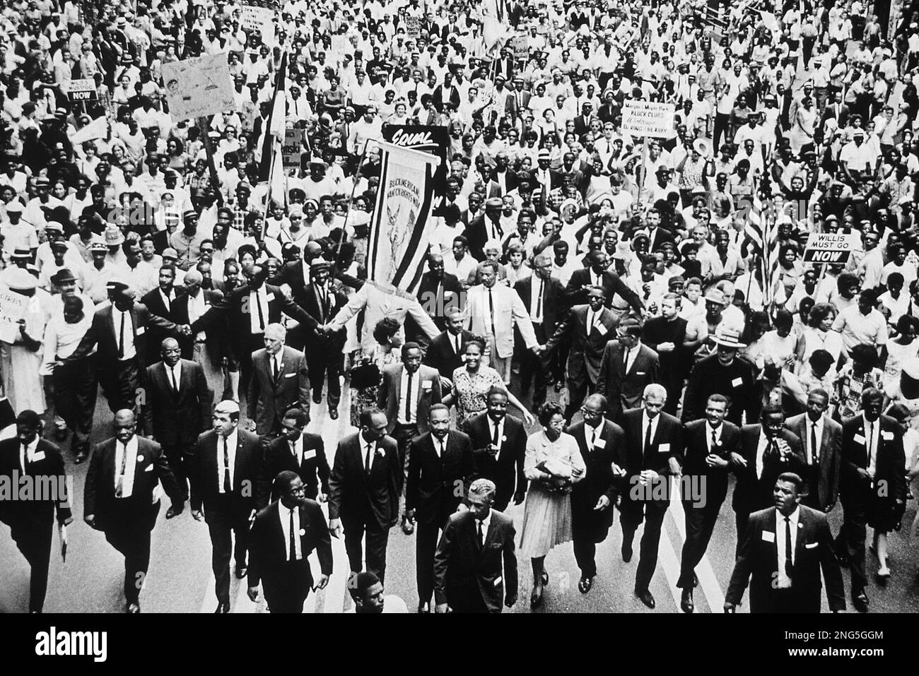 Reverend Martin Luther King, Jr. center foreground, walks in crowd ...