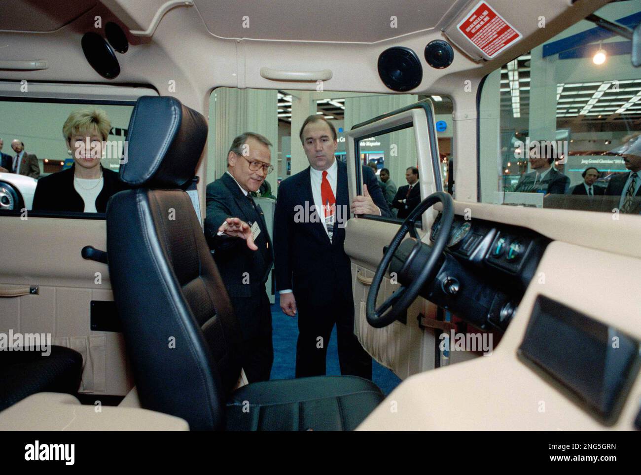 ASG Inc. chairman Heinz C. Prechter, center, points out the features of ...