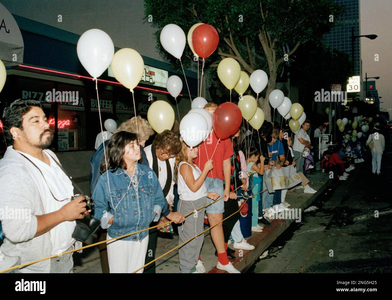 Balloon -ladened faithful line downtown Los Angeles streets early Sep ...