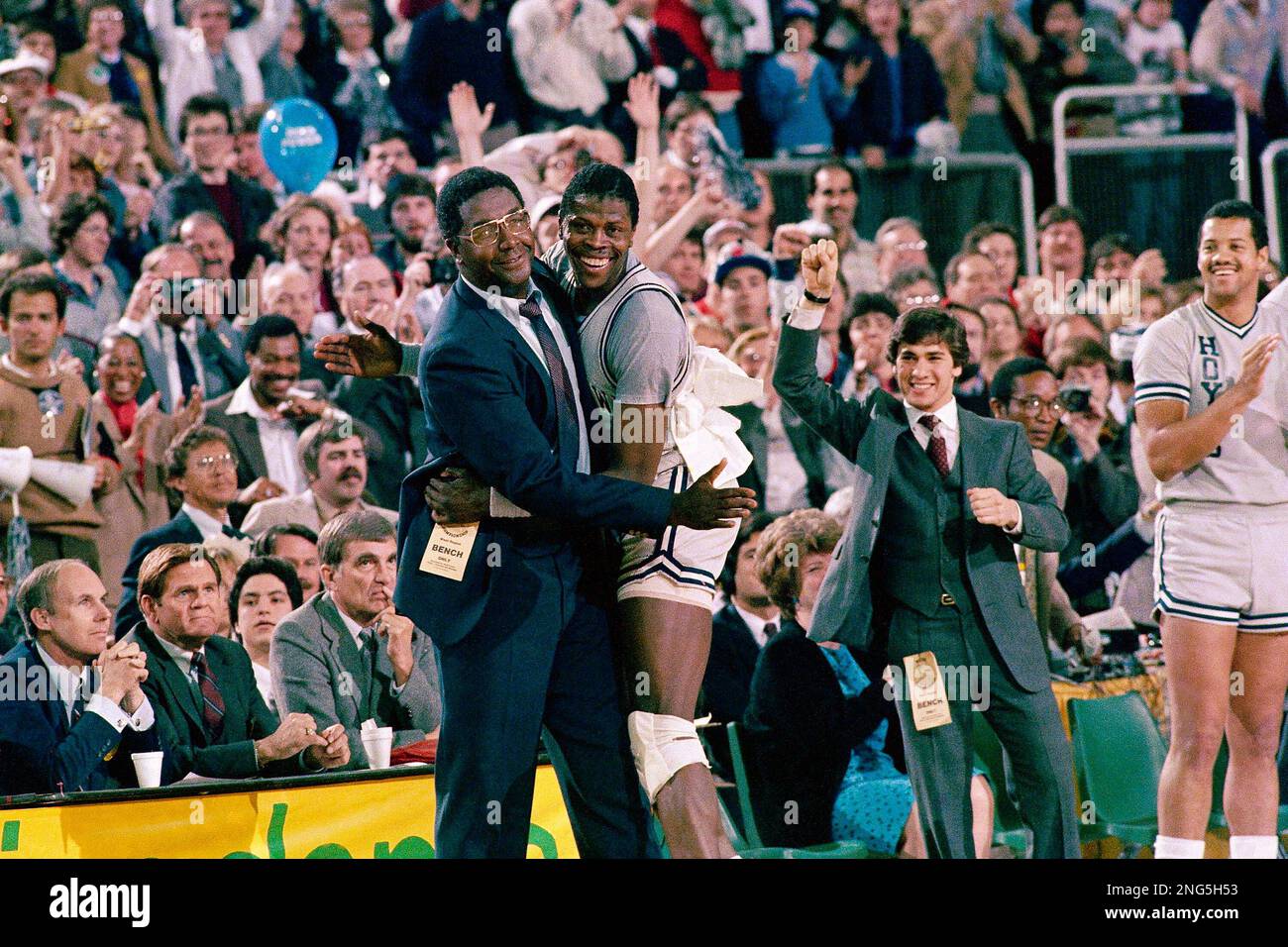 Georgetown head coach John Thompson, left, gives a happy pat to the ...