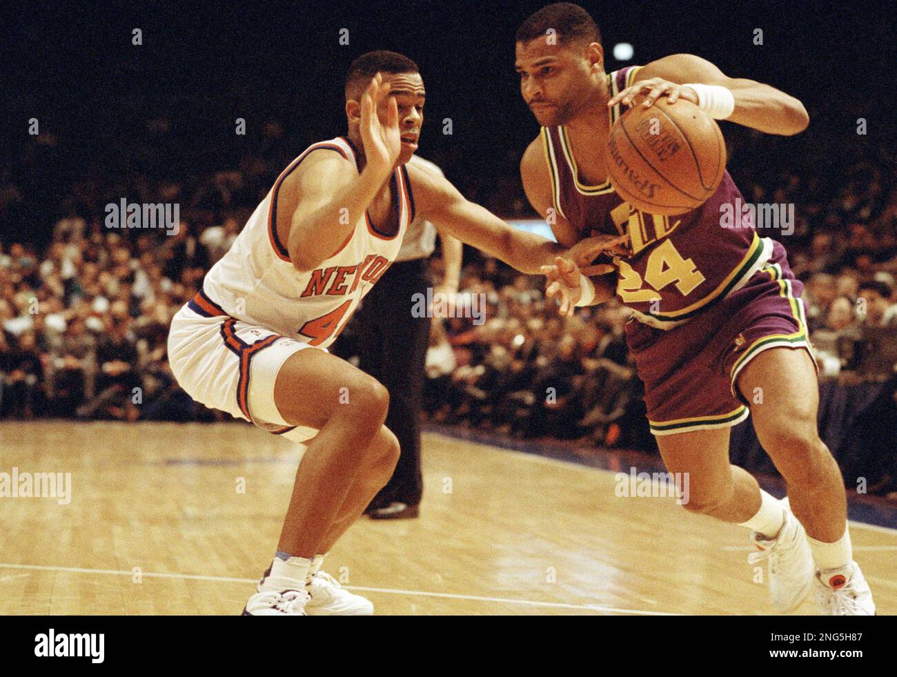 Utah Jazz player Jeff Malone, right , drives around New York Knicks ...