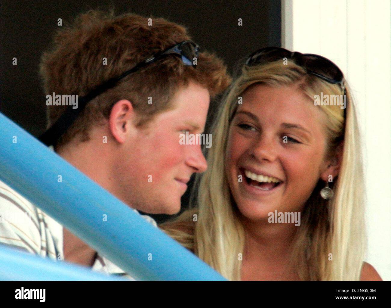 Britain's Prince Harry, left, and Chelsy Davy chat while attending the ...
